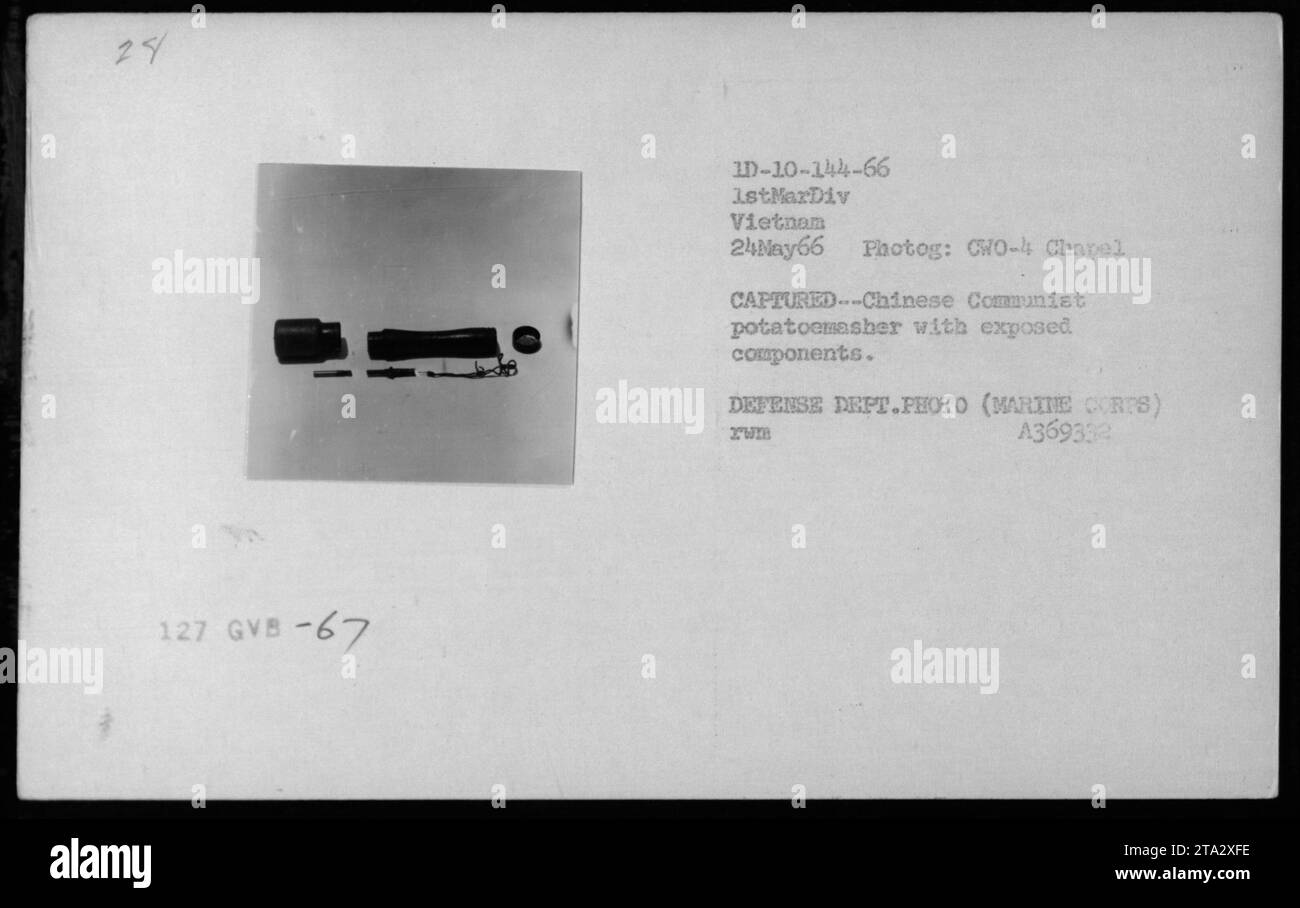 A Chinese Communist potato masher with exposed components being ...