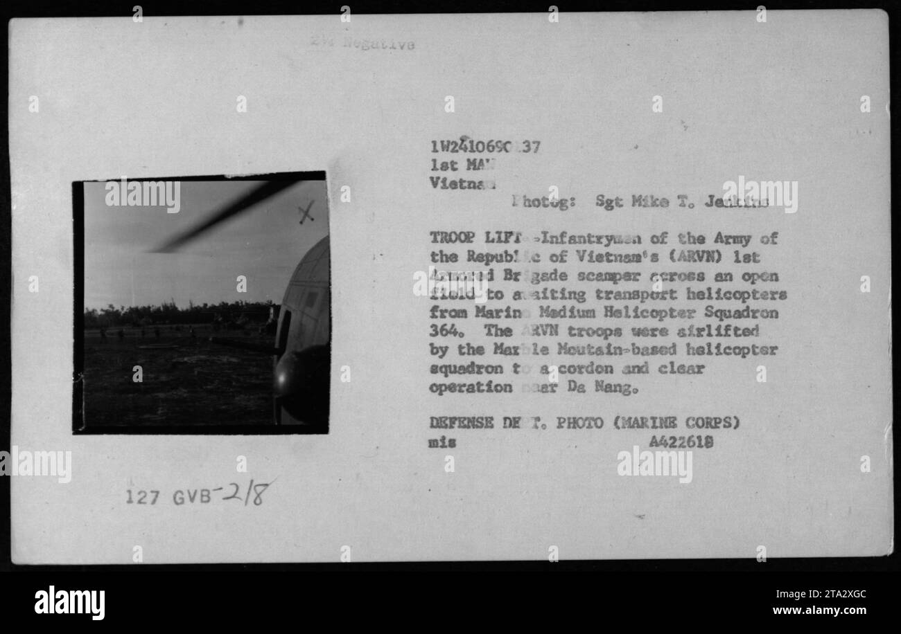 Infantrymen of the ARVN 1st Armored Brigade are seen crossing an open ...