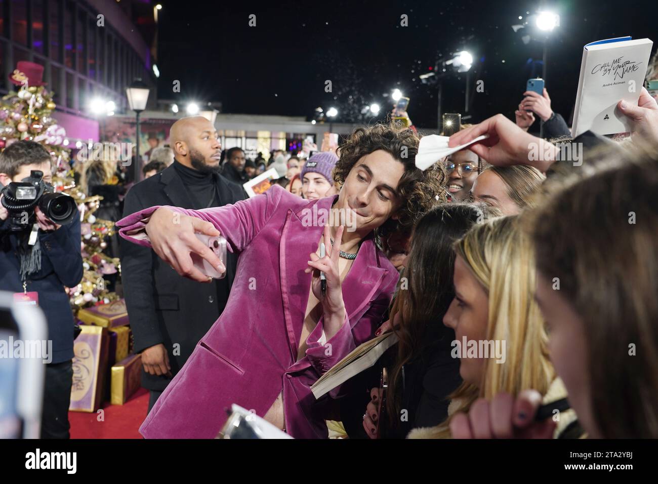 Timothee Chalamet takes selfies with fans as he arrives for the world ...