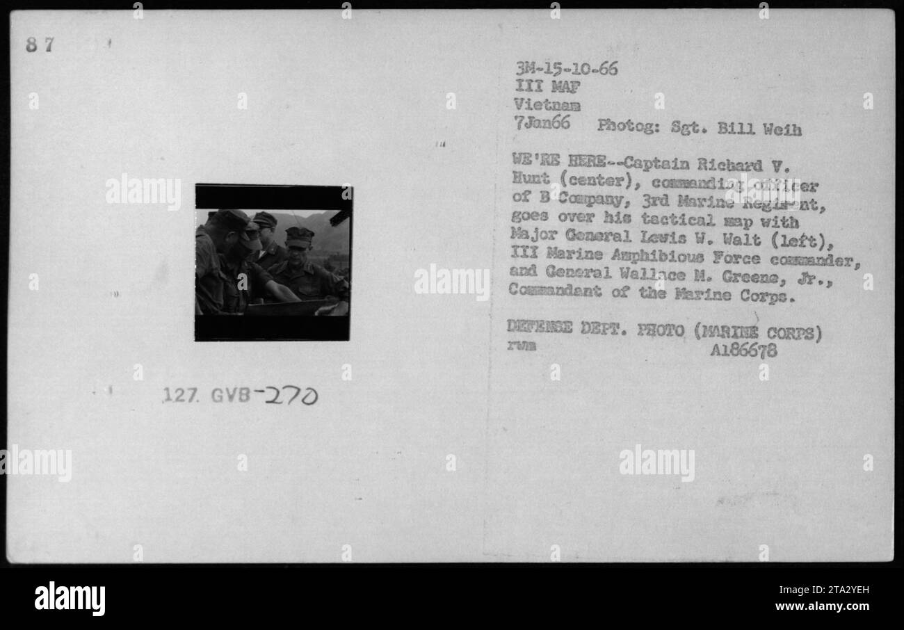 "Captain Richard V. Hunt (center), commanding officer of B Company, 3rd ...