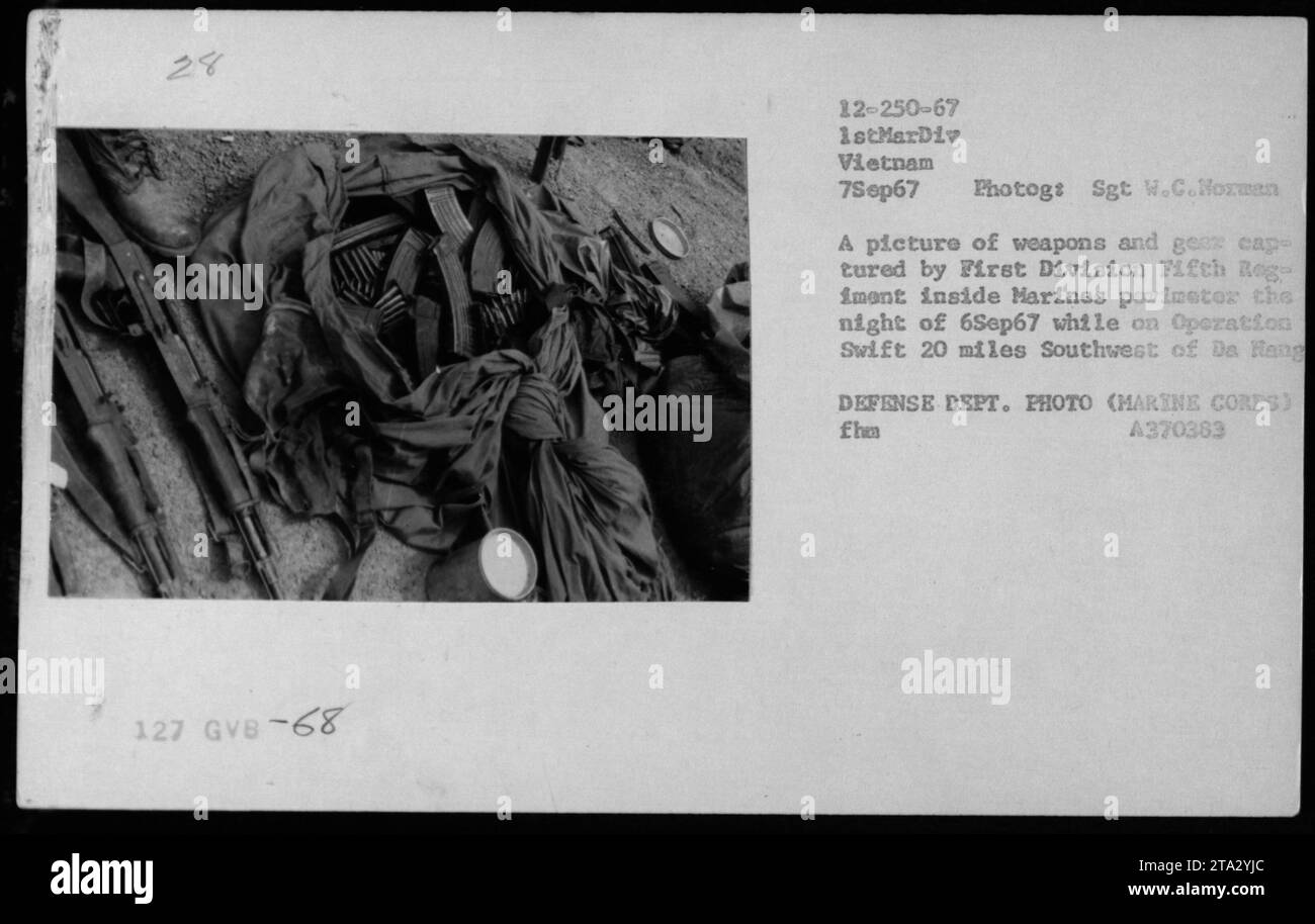 Photograph showcasing a collection of weapons and gear captured by the ...