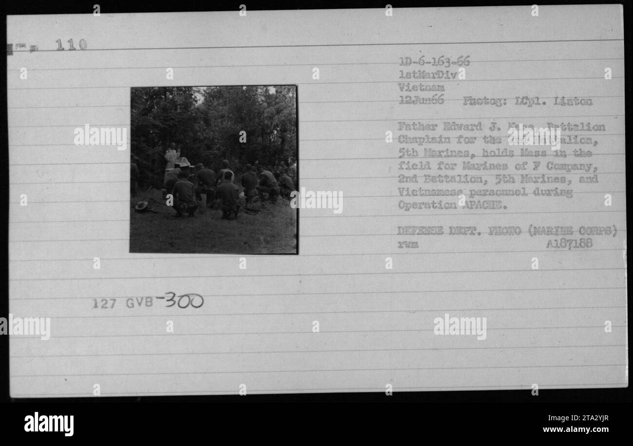 Battalion Chaplain Father Edward J. Kane holds a field Mass for 7 ...