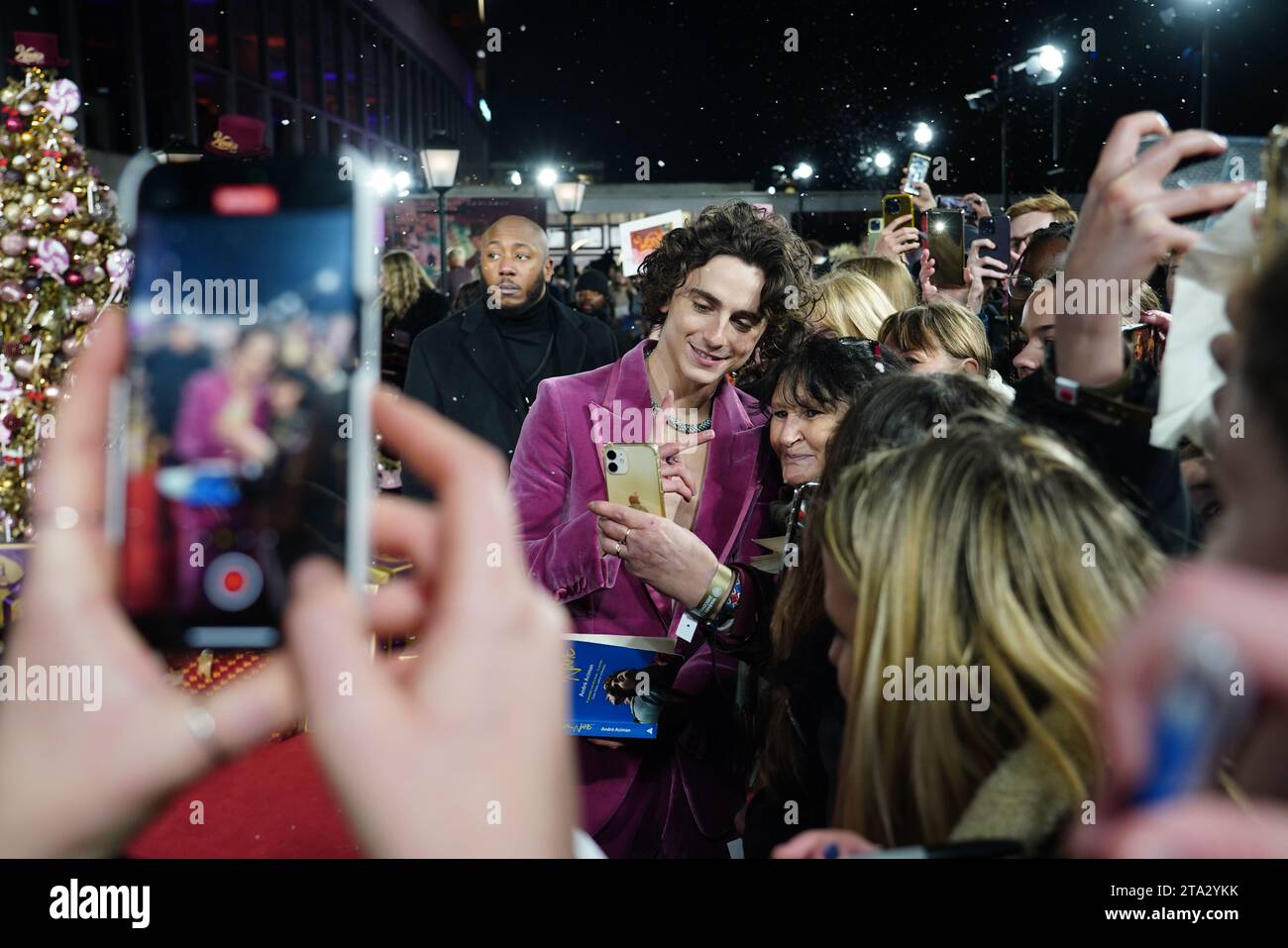 Timothee Chalamet takes selfies with fans as he arrives for the world ...