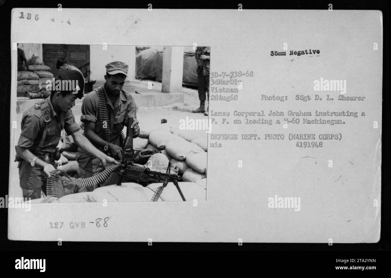 Lance Corporal John Graham provides instruction on loading an H-60 ...