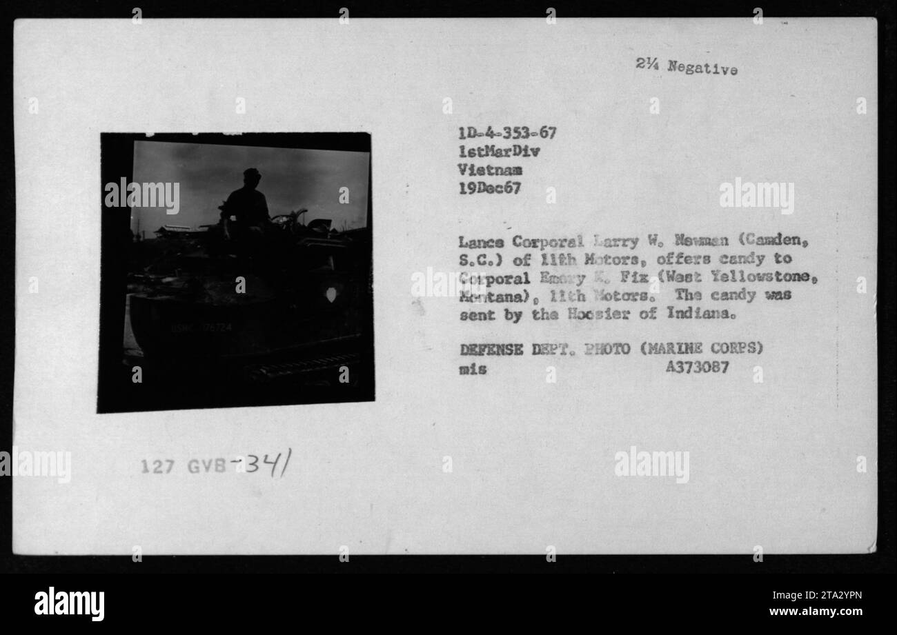 Lance Corporal Larry W. Newman from 11th Motors offers candy to ...