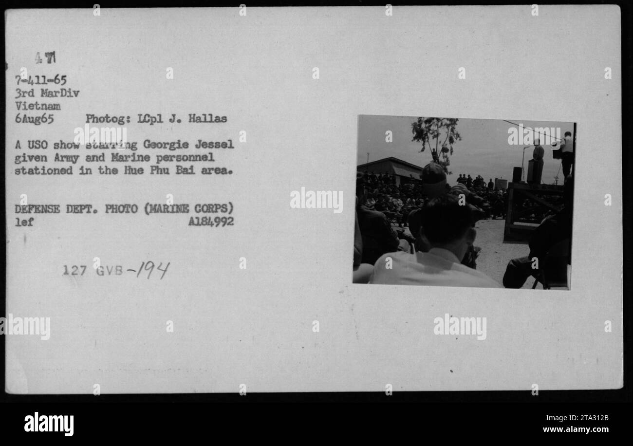 Martha Raye, Lt. Commander Glenn Ford, and Bob Hope perform a USO show ...