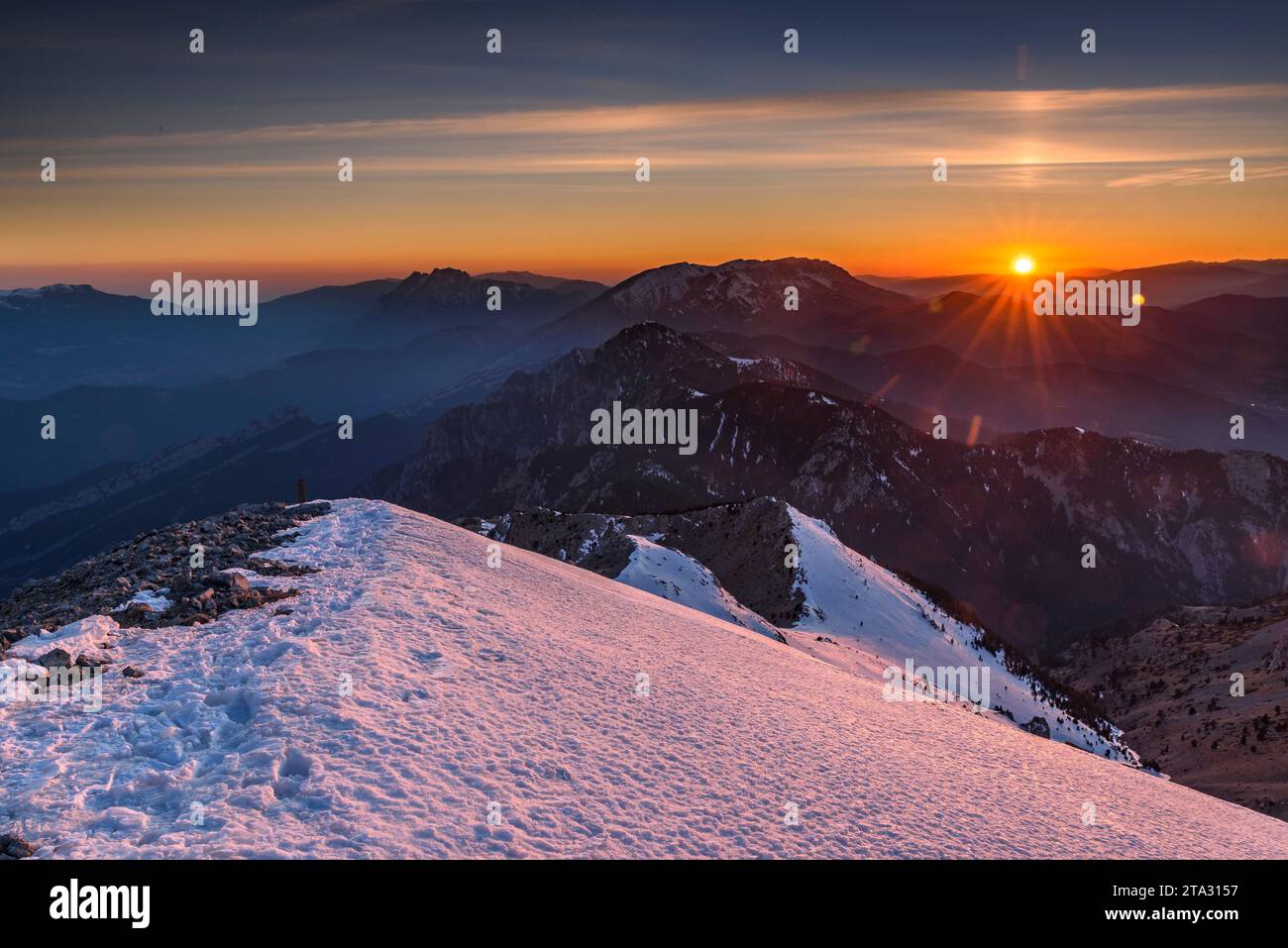 Sunset from the summit of the snowy Tosa d'Alp in winter looking ...