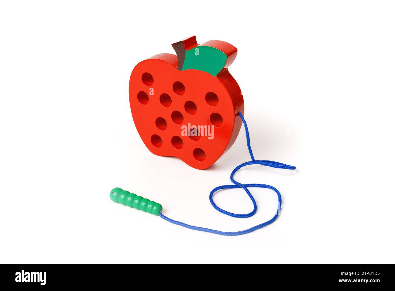 Children's wooden toy in the shape of a red apple with a worm on a rope ...