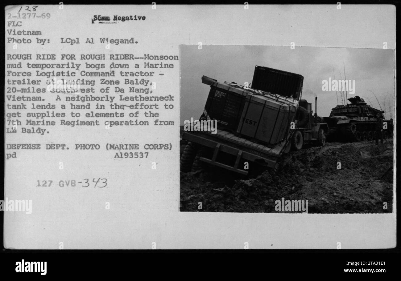 A Marine Force Logistic Command tractor-trailer becomes stuck in ...