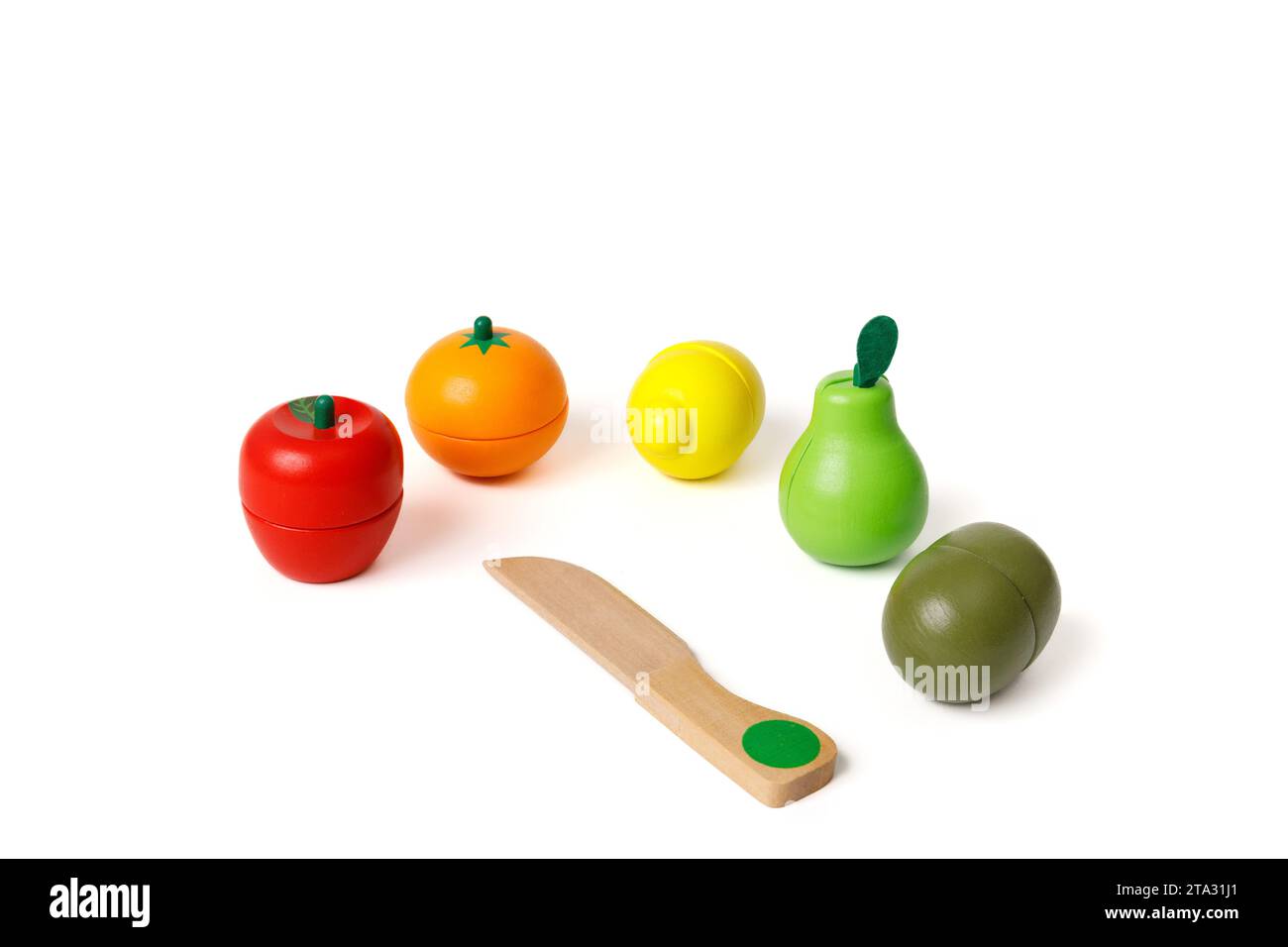 Multi-colored toys in the shape of fruits and a wooden knife for ...