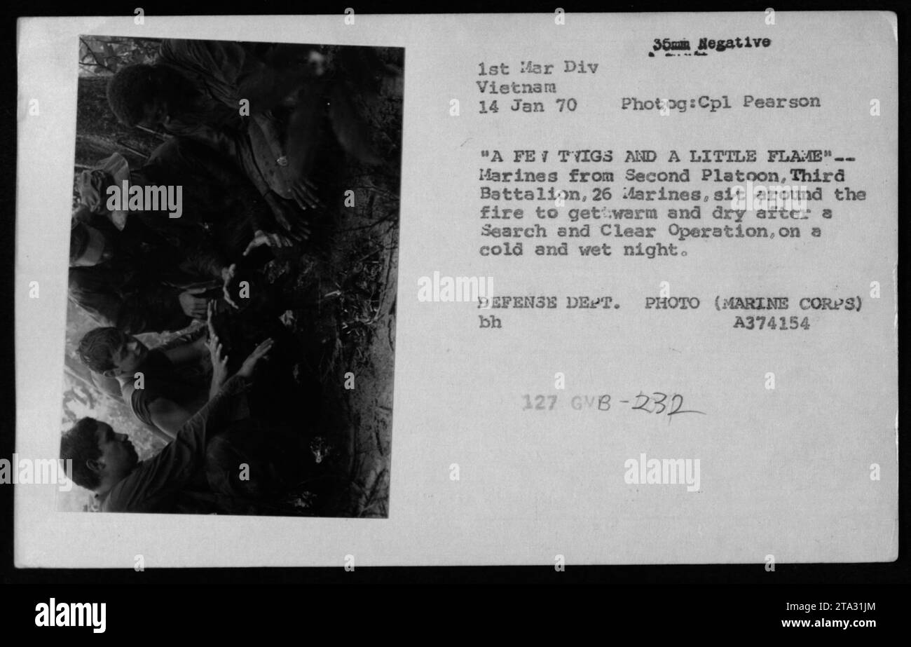 Second Platoon, Third Battalion, 26 Marines gather around a fire after ...