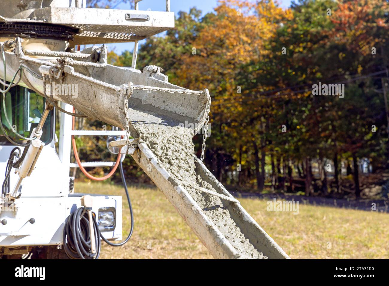 Construction site liquid cement concrete was poured from concrete mixer ...
