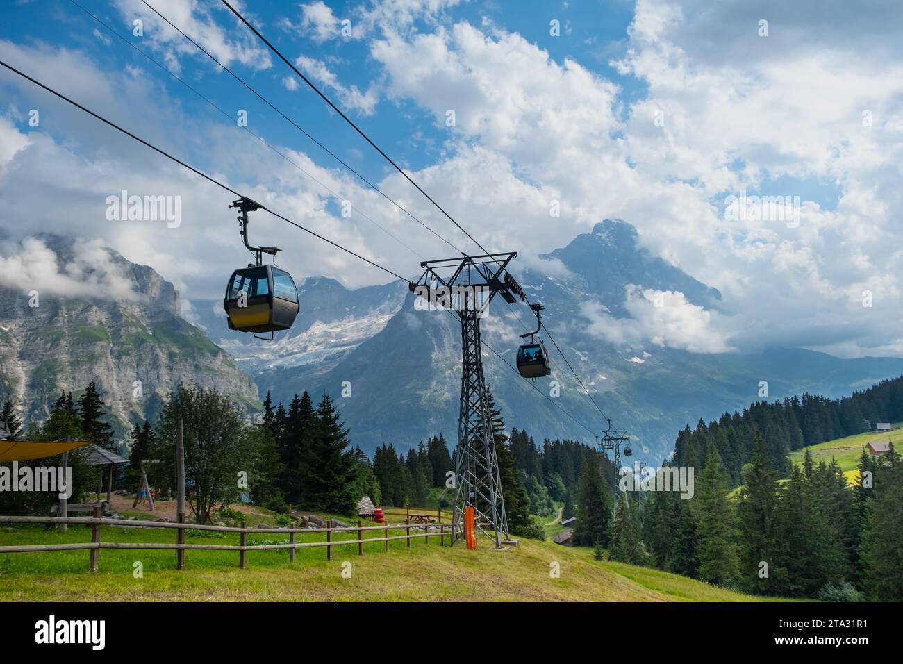 Cable car in Swiss Alps. Gondola from Grindelwald in Jungfrau. Summer ...
