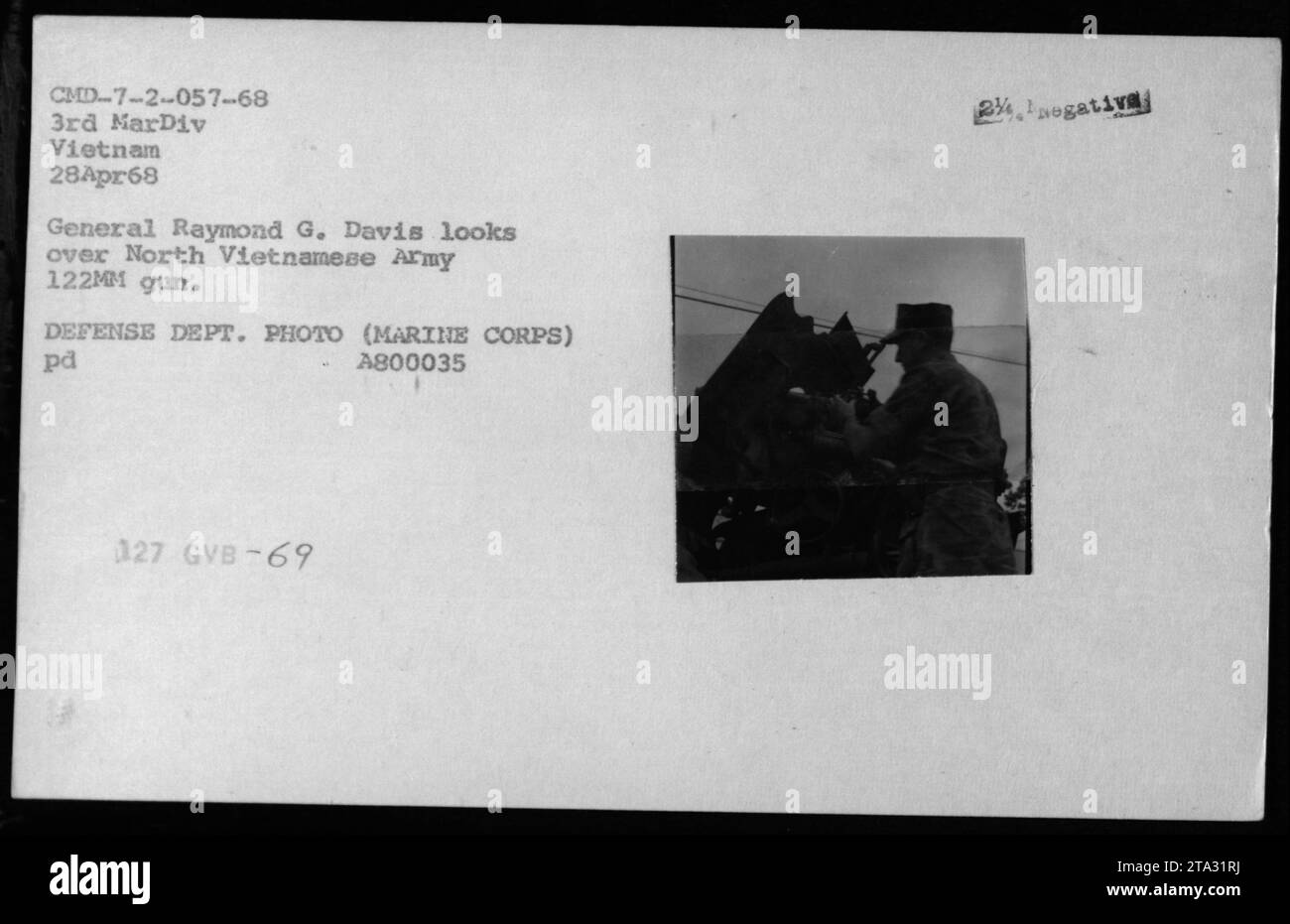 General Raymond G. Davis views a captured North Vietnamese Army 122MM ...