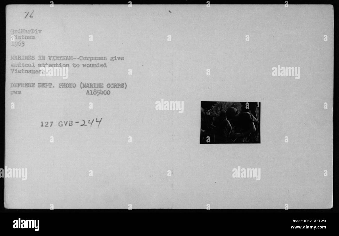 Marine Corps corpsmen provide medical assistance to wounded Vietnamese ...