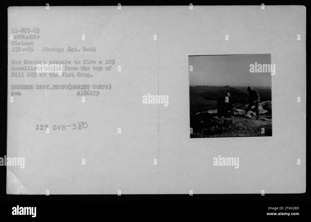 Two Marines prepare to fire a 105mm recoilless rifle from Hill 225 ...