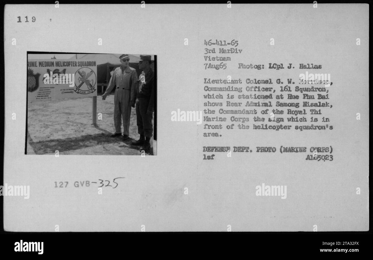 Lieutenant Colonel G.W. Morrison shows Rear Admiral Samong Nisalak a ...