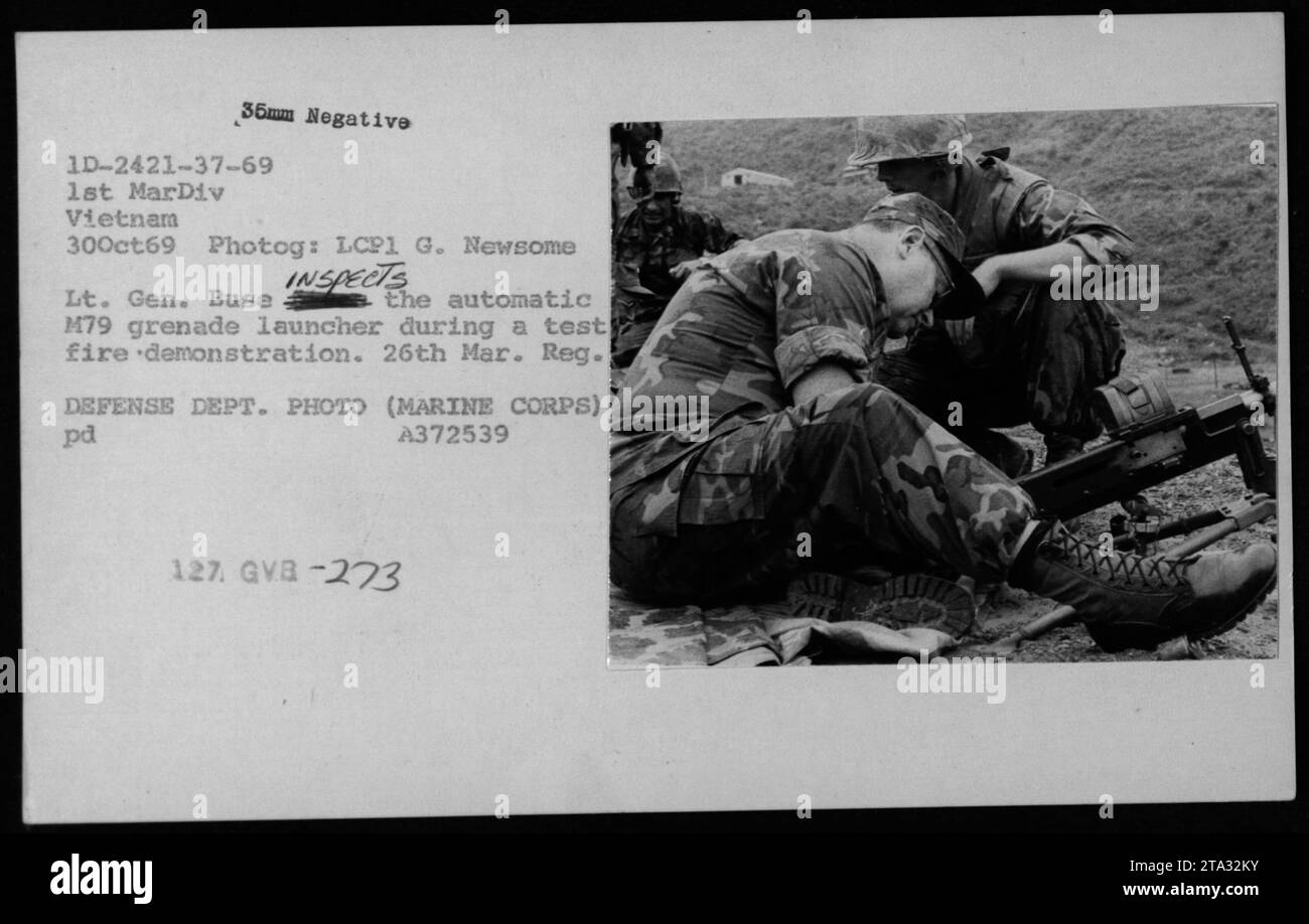 Lt. Gen. Buse inspects an automatic M79 grenade launcher during a test ...