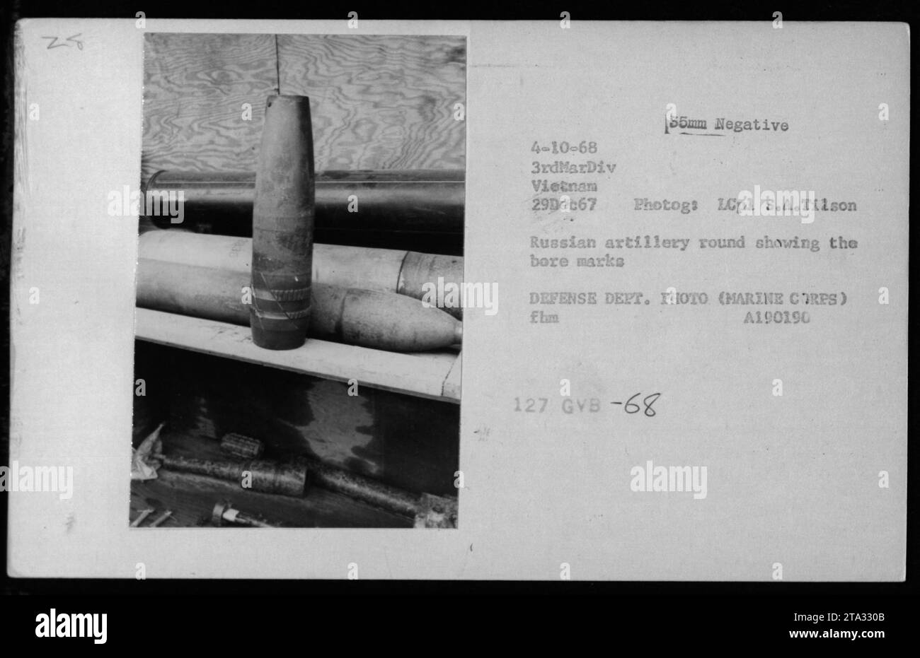 A captured Russian artillery round with visible bore marks. This ...