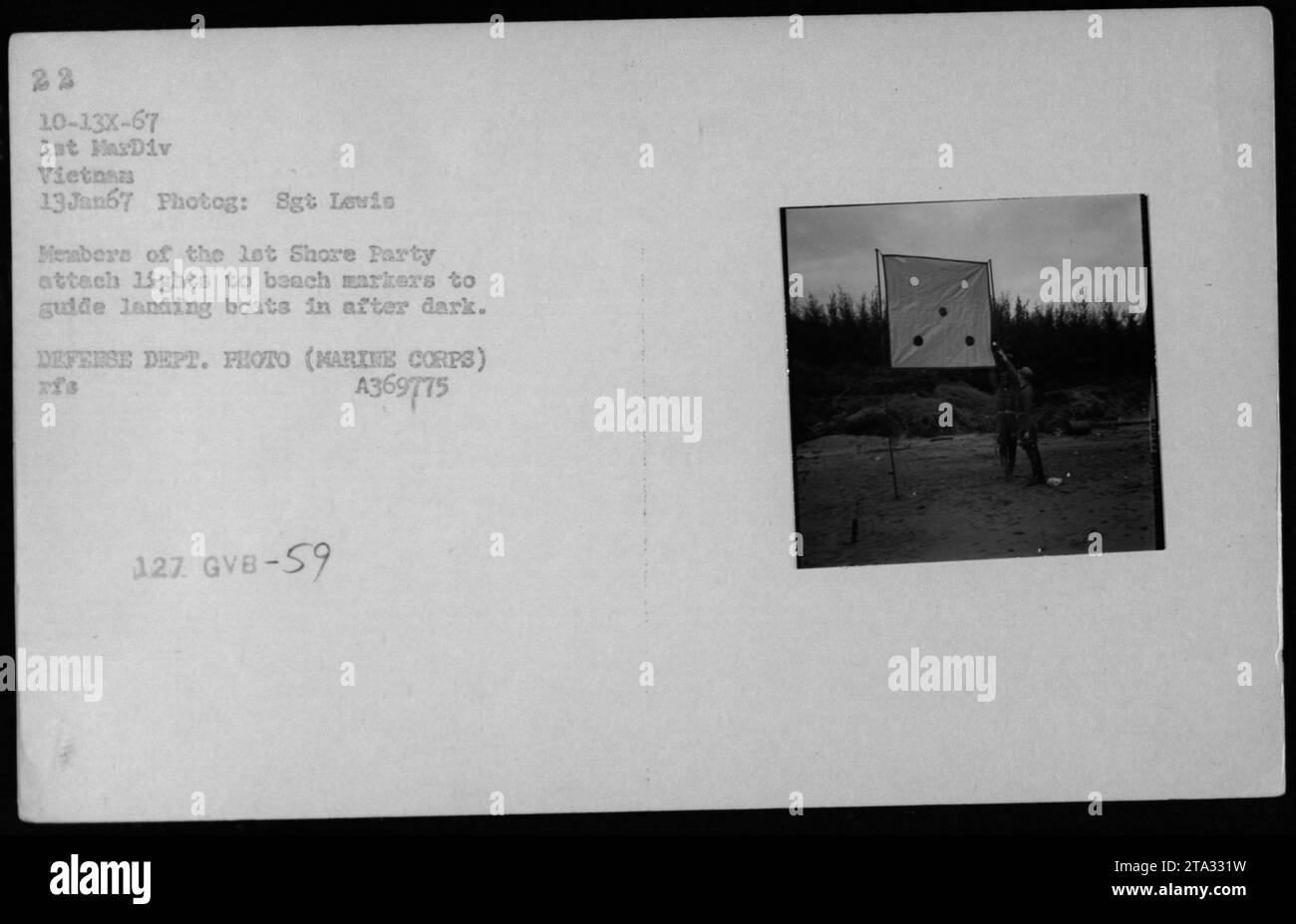 Marine Corps soldiers from the 1st Shore Party are seen attaching ...