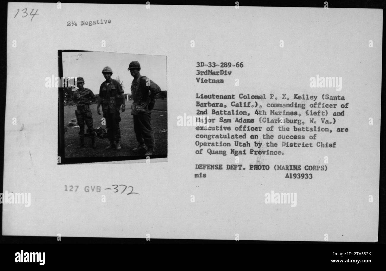 Lieutenant Colonel P. X. Kelley and Major Sam Adams are congratulated ...