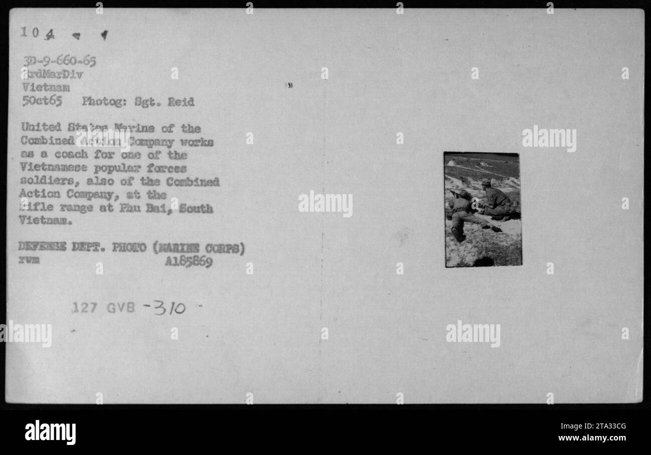 On October 5, 1965, Sgt. Reid, a U.S. Marine, coaches a Vietnamese ...