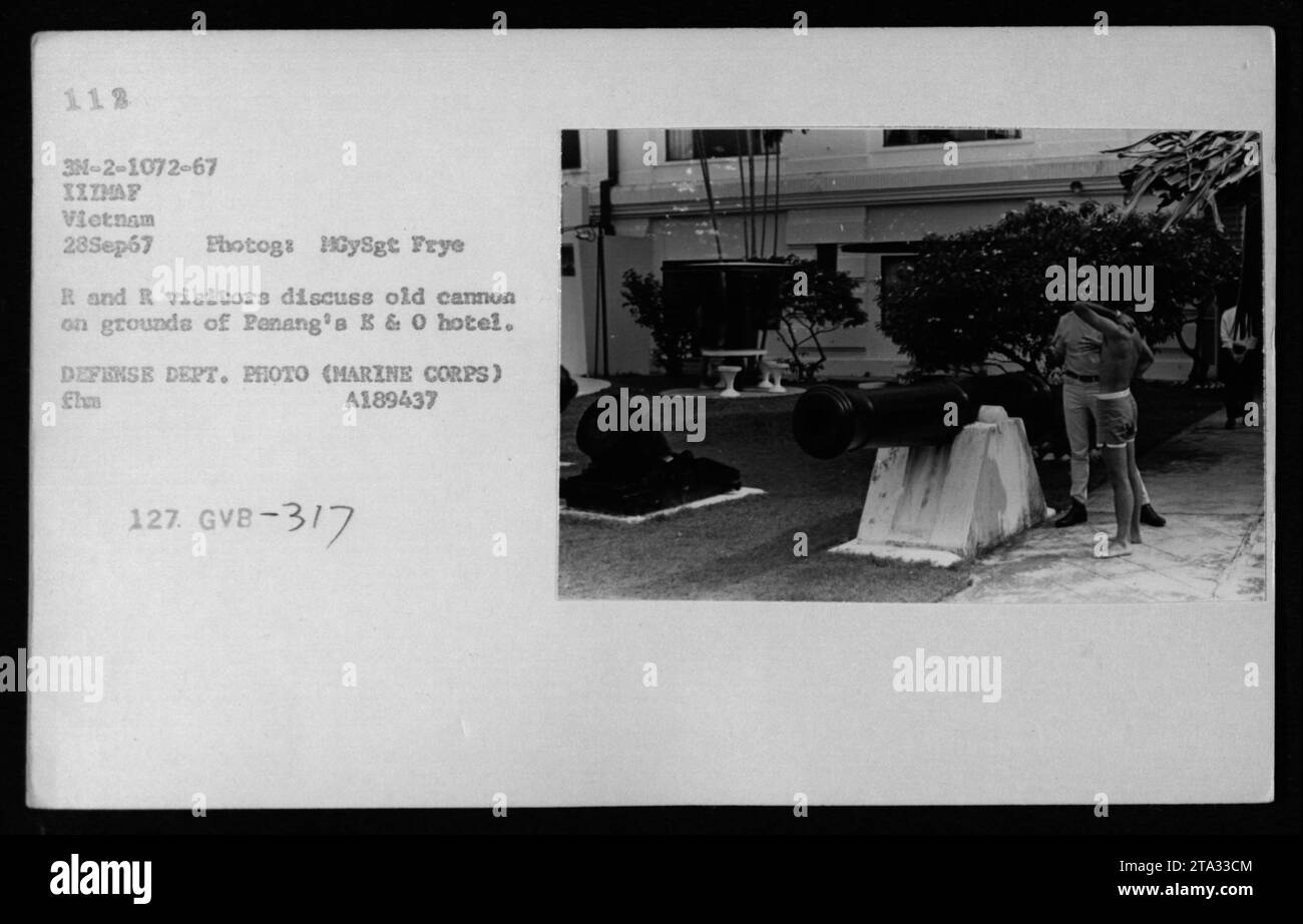 On September 28, 1967, US soldiers were photographed discussing an old ...