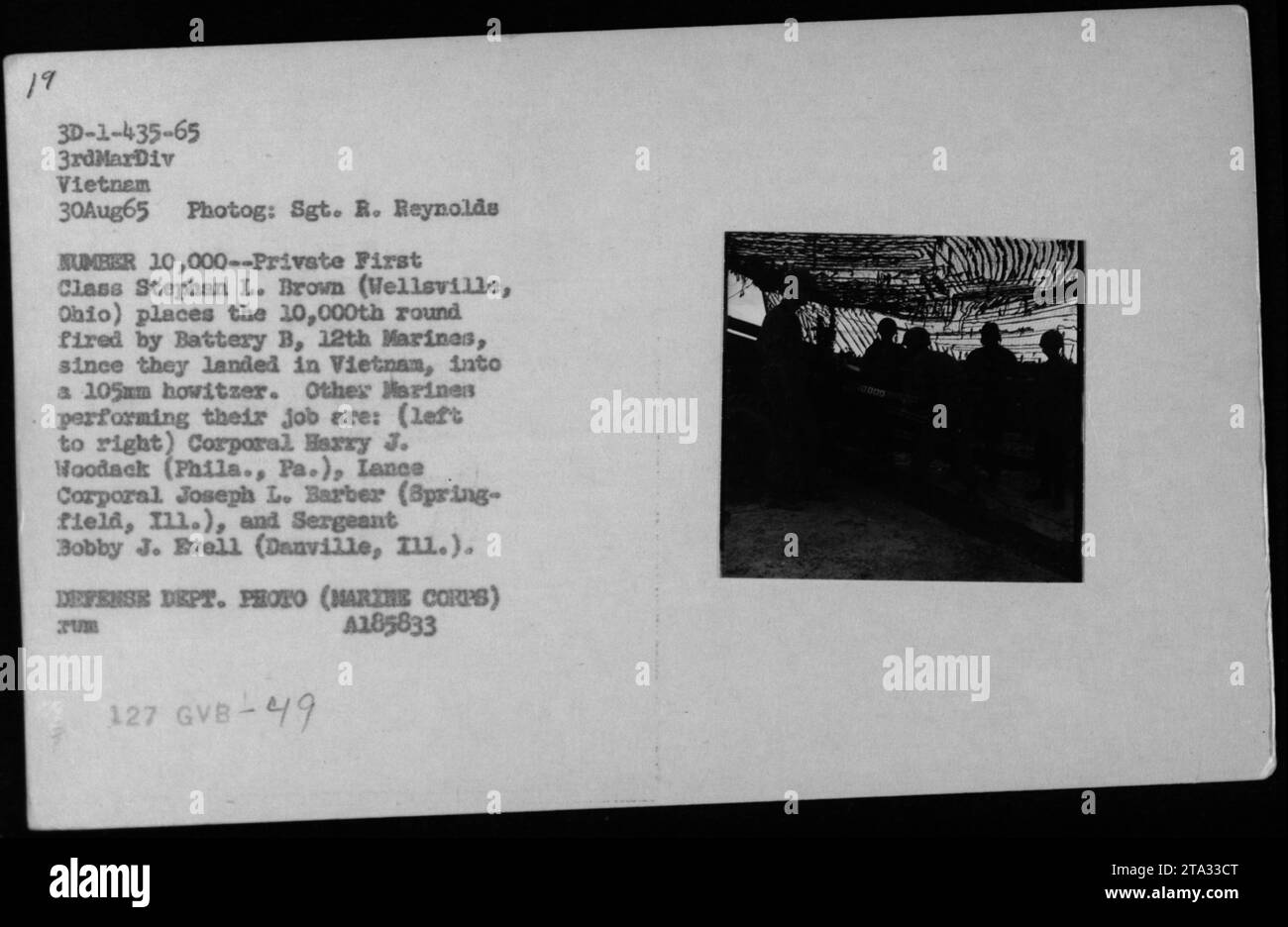 Pvt. Stephan L. Brown loads the 10,000th round into a 105mm howitzer of ...