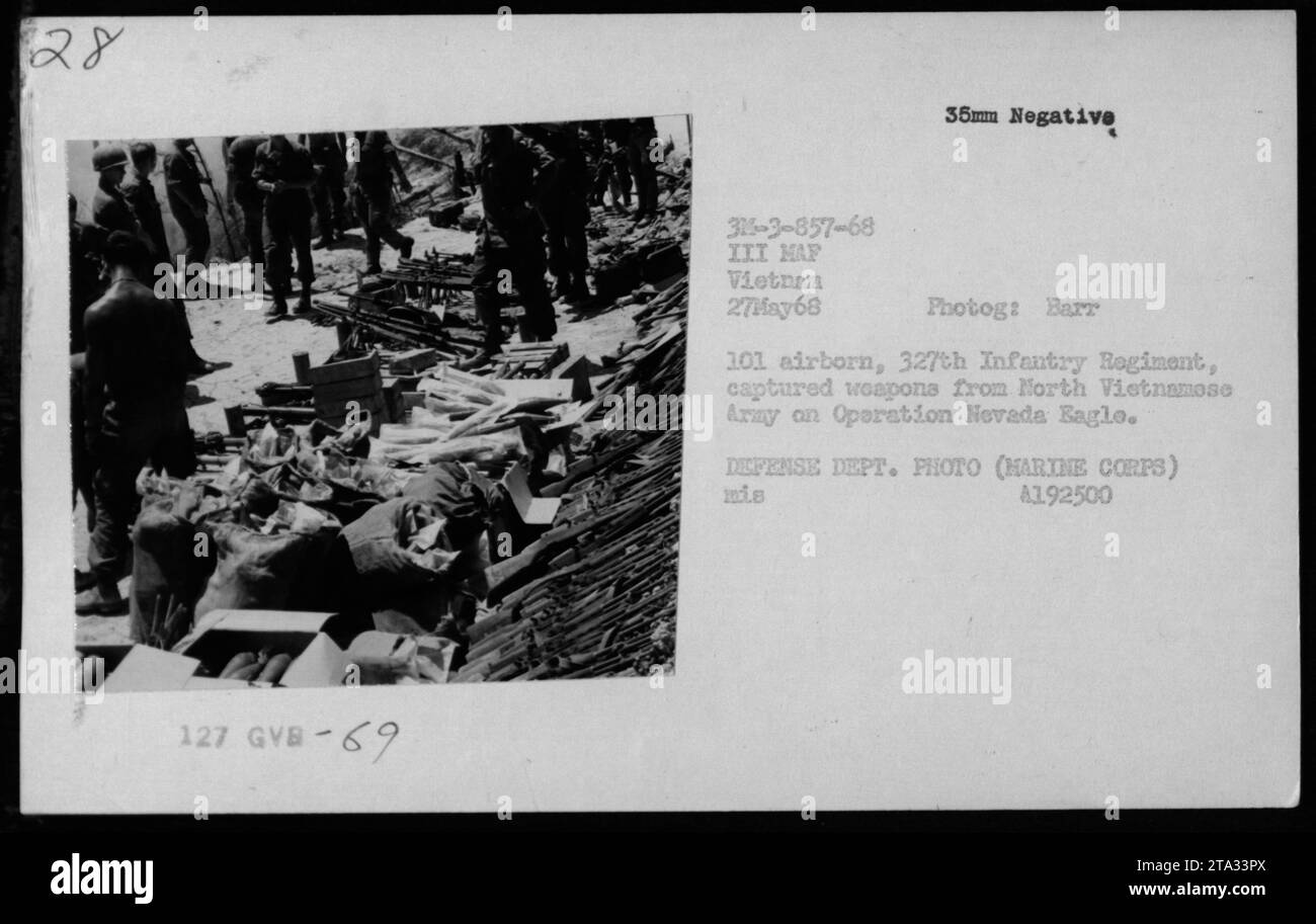 US Army soldiers inspect and document captured weapons from the North ...