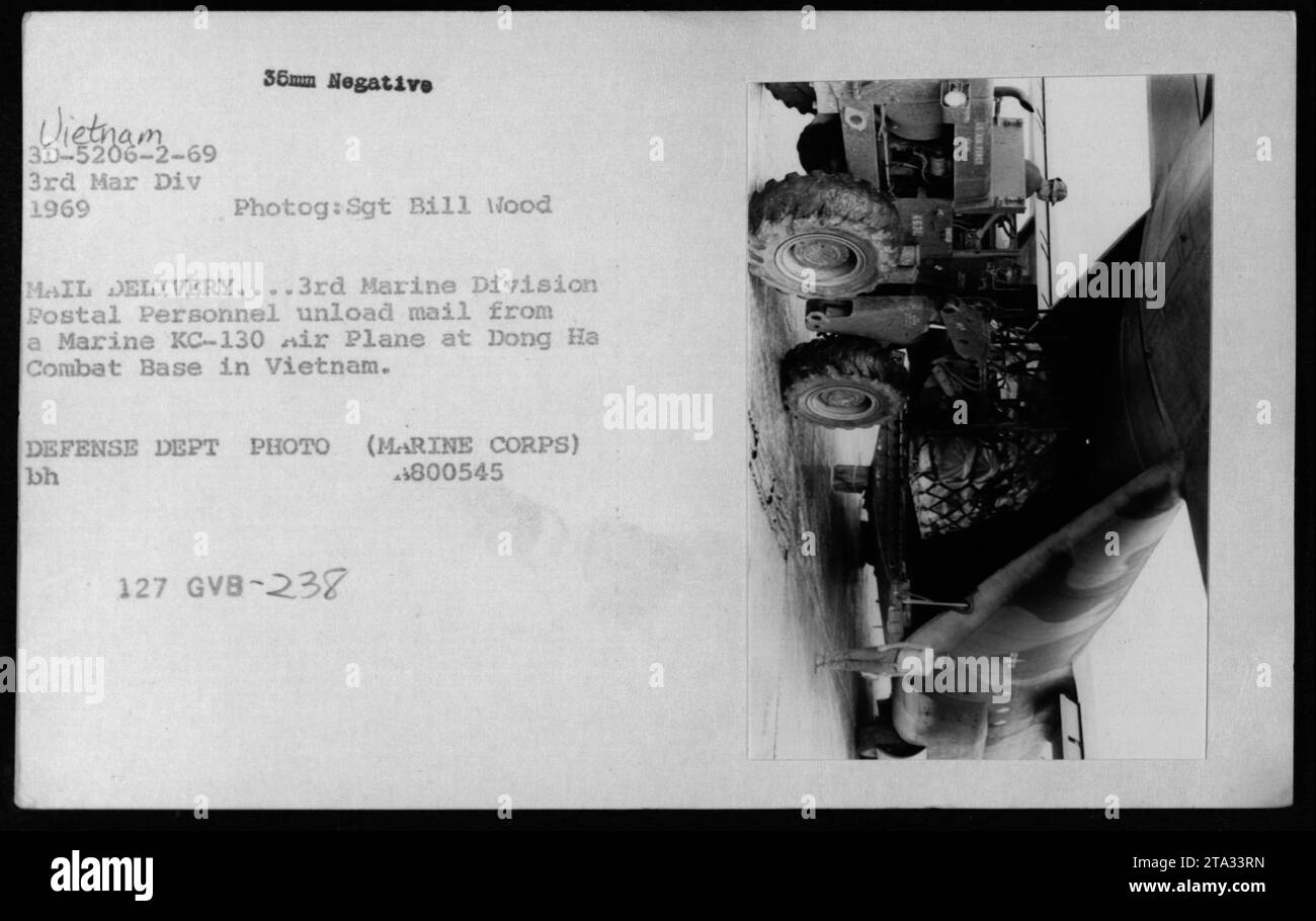 Postal personnel from the 3rd Marine Division unload mail from a KC-130 ...