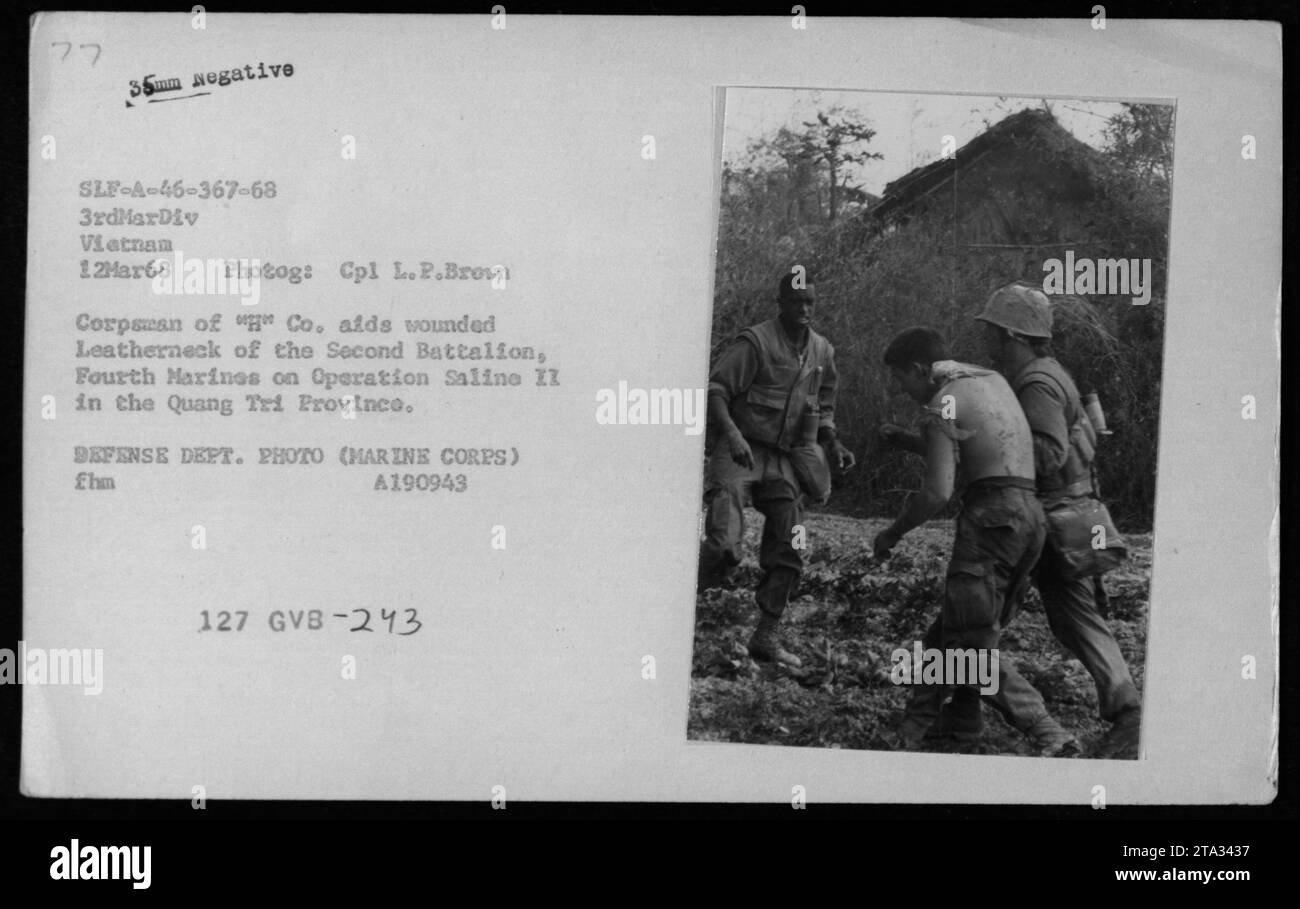 A Marine Corps corpsman from "Co. provides medical aid to a wounded ...