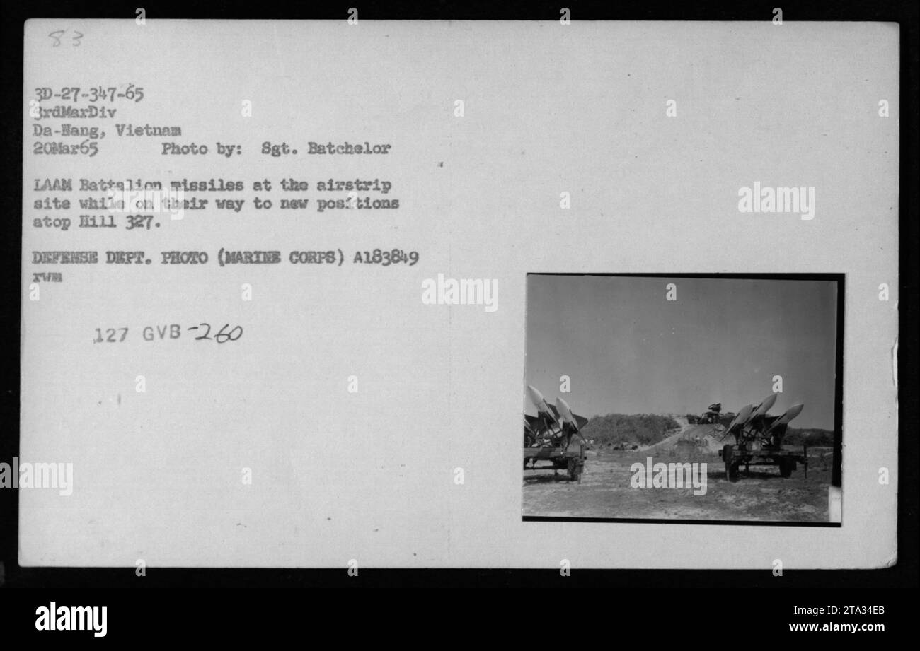 Marines in Da-Hang, Vietnam, on March 20, 1965, relocate weapons atop ...