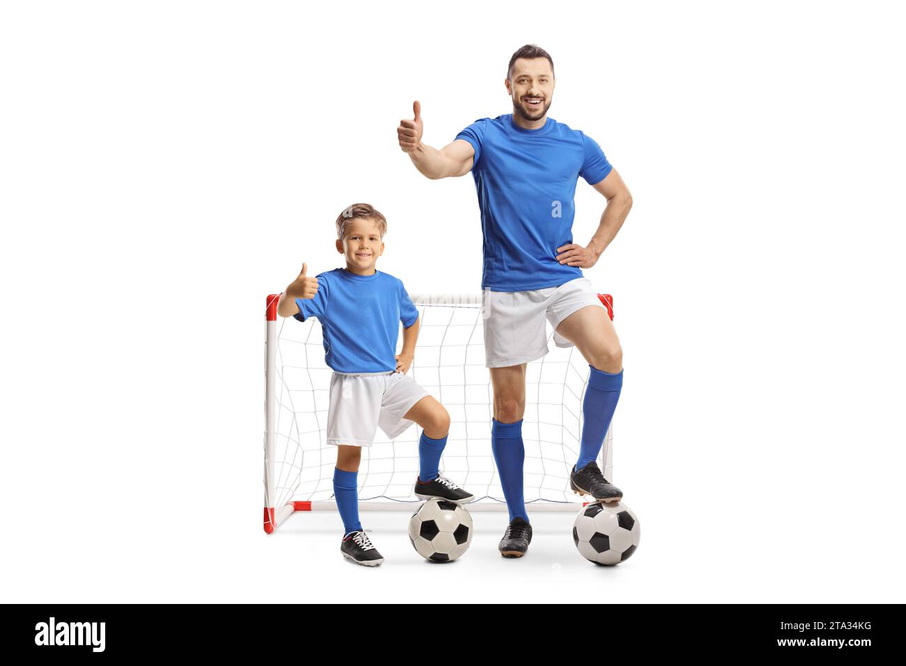 Man and boy in front of a goal gesturing thumbs up isolated on white ...