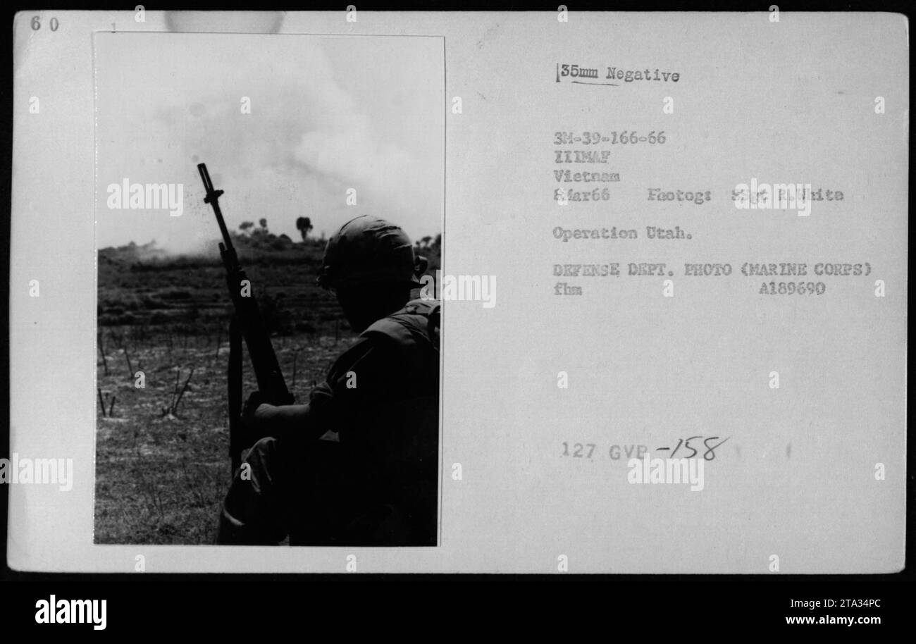 A U.S. Marine engages in combat during Operation Utah in Vietnam. The ...