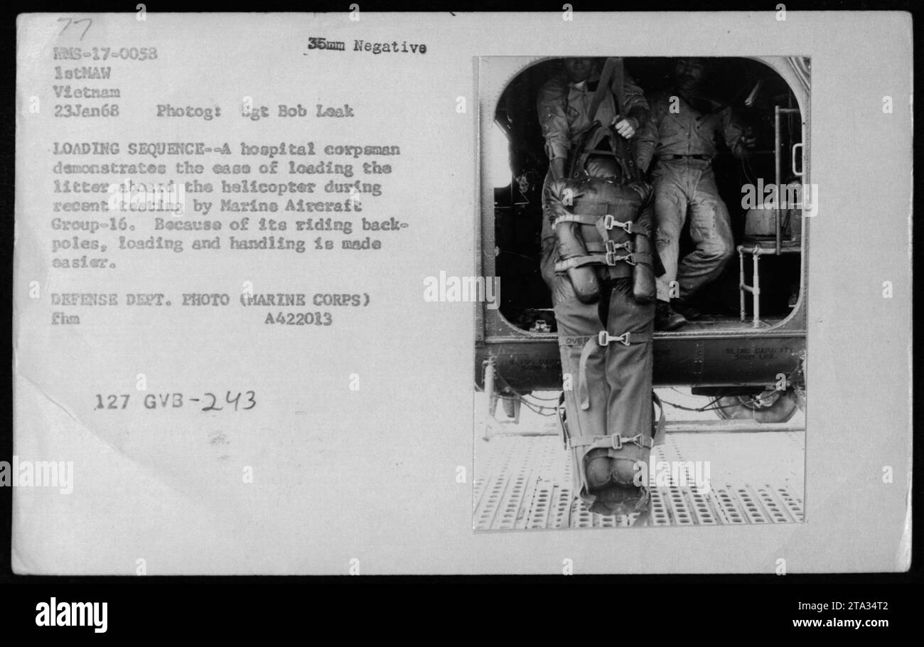A hospital corpsman demonstrates loading a litter onto a helicopter ...