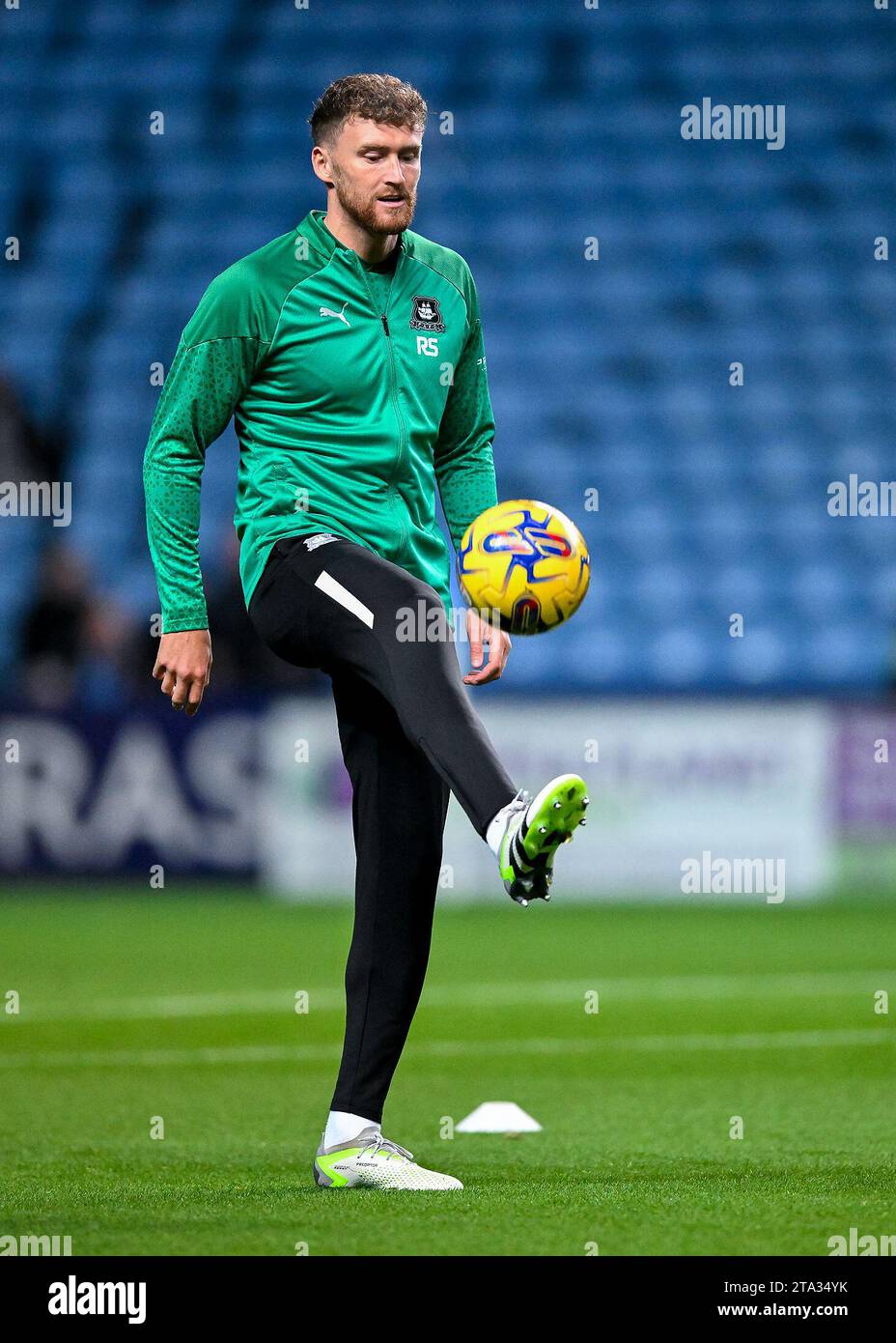 Dan Scarr #6 of Plymouth Argyle warming up during the Sky Bet ...