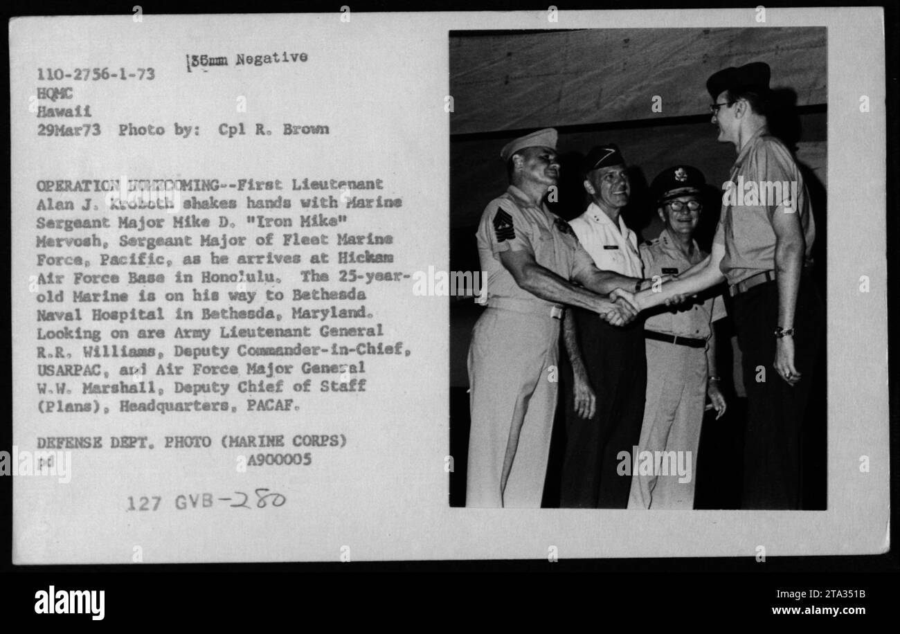 On March 29, 1973, First Lieutenant Alan J. Kroboth shakes hands with ...