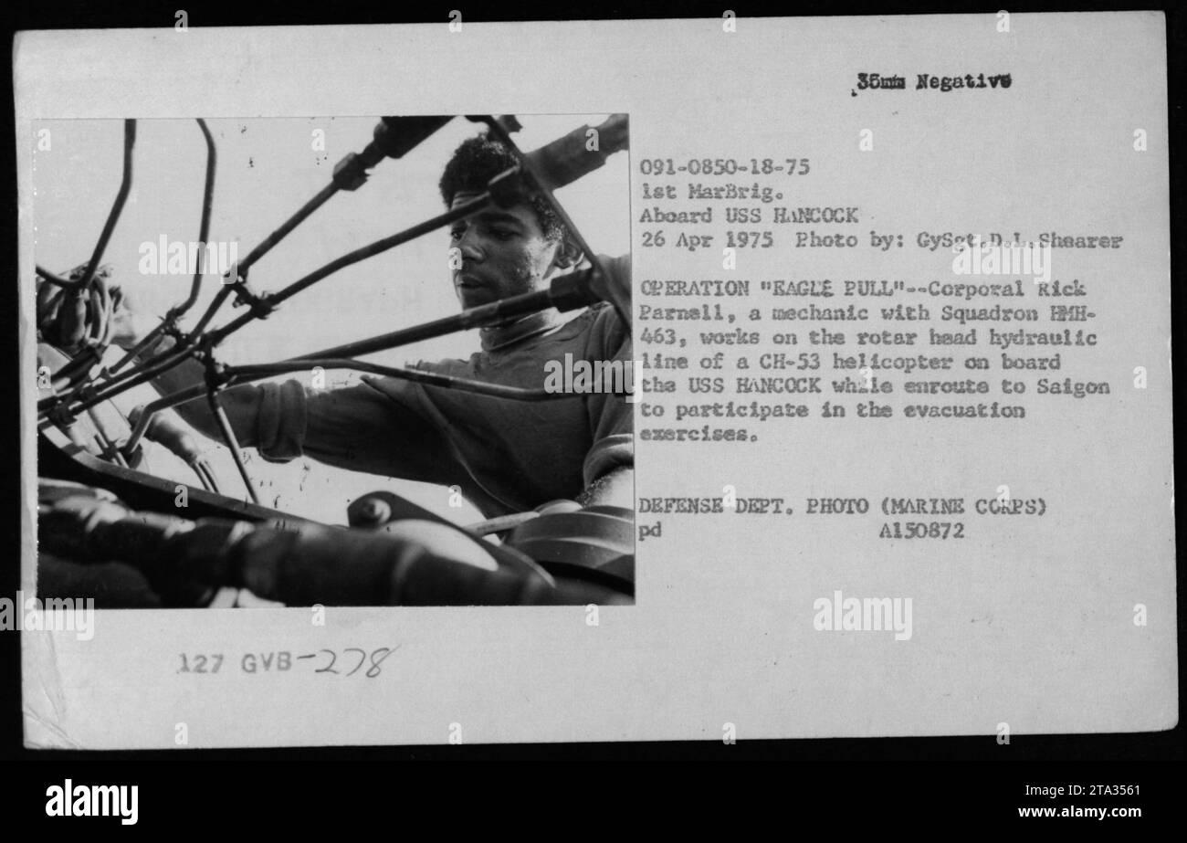 Corporal Rick Parnell, a mechanic with Squadron HMH- 463, is seen ...