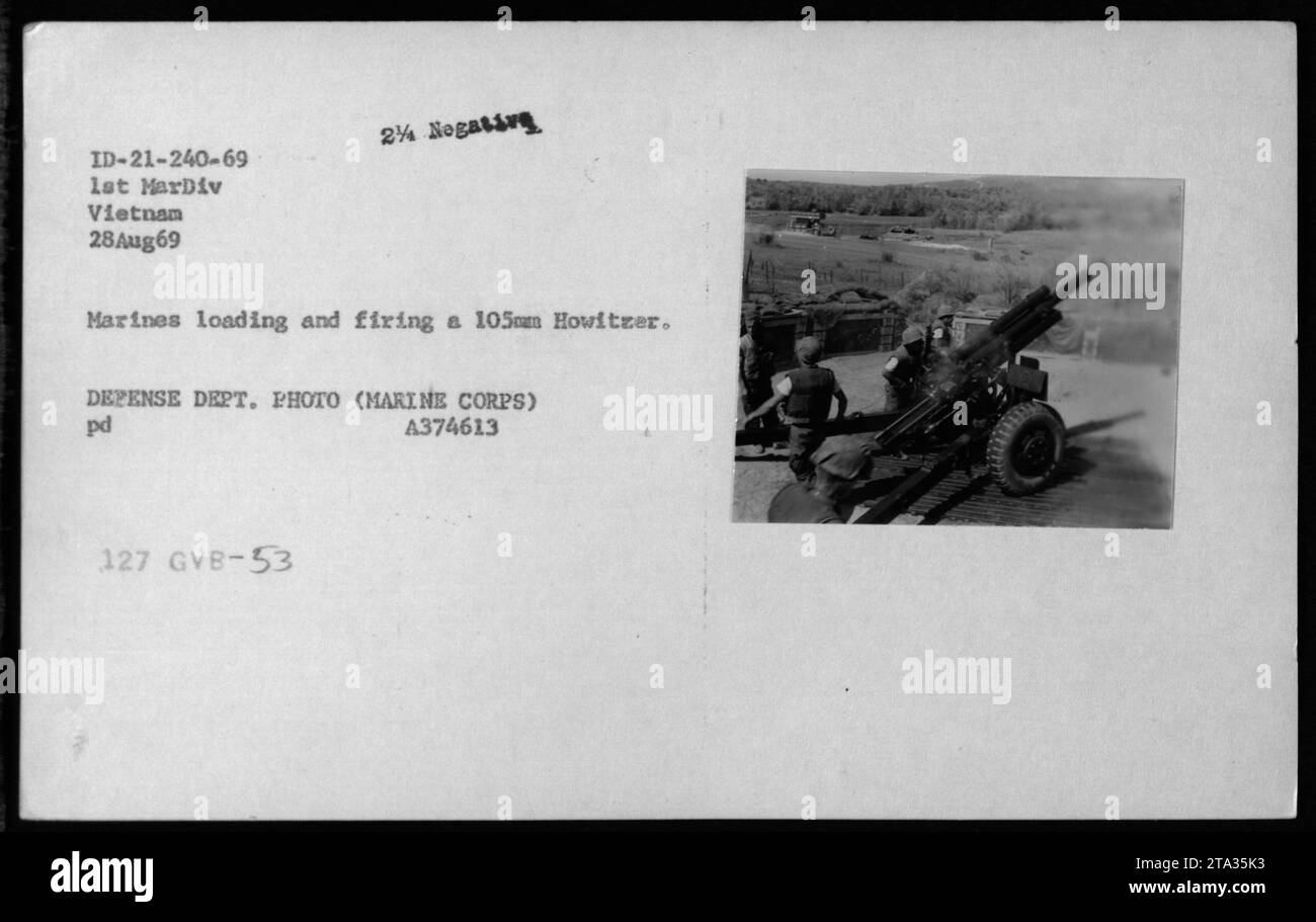 Marines from the 1st Division of the U.S. Marine Corps operate a 105mm Howitzer in Vietnam on ...