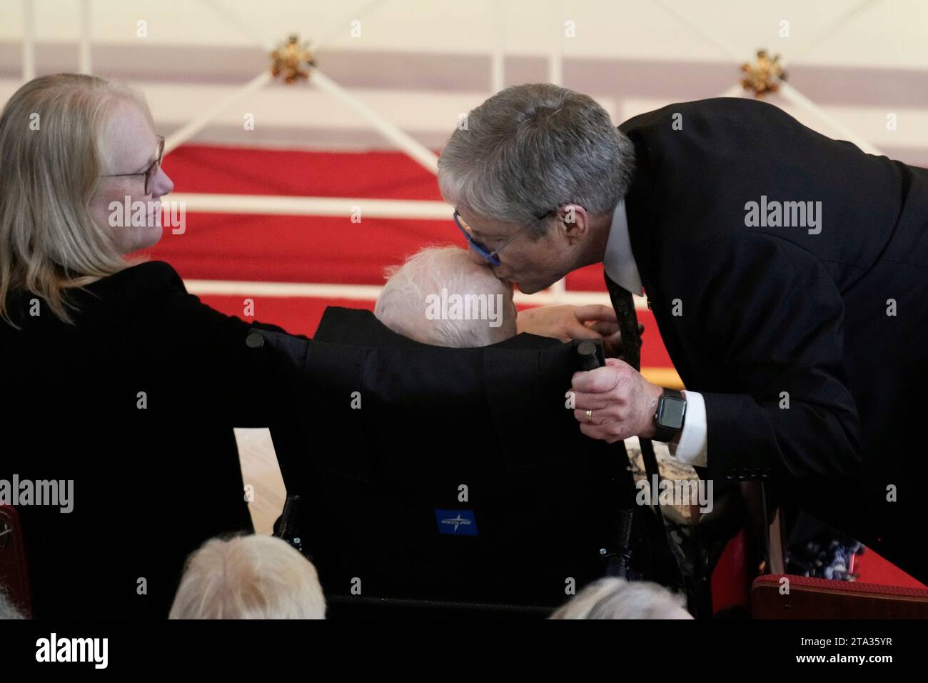 James "Chip" Carter kisses his father, former President Jimmy Carter ...