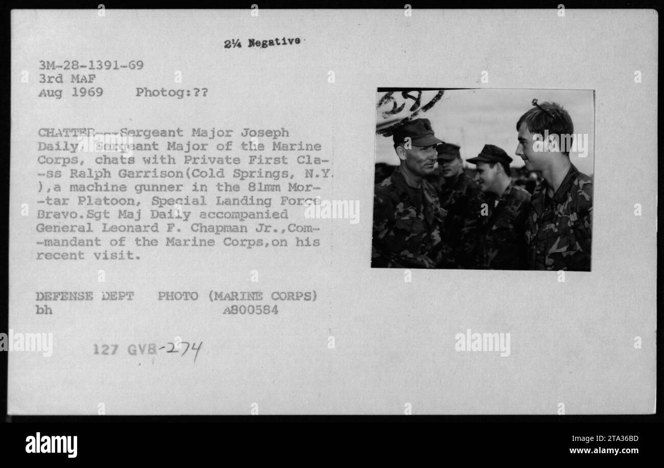 Sergeant Major Joseph Daily converses with Private First Class Ralph ...