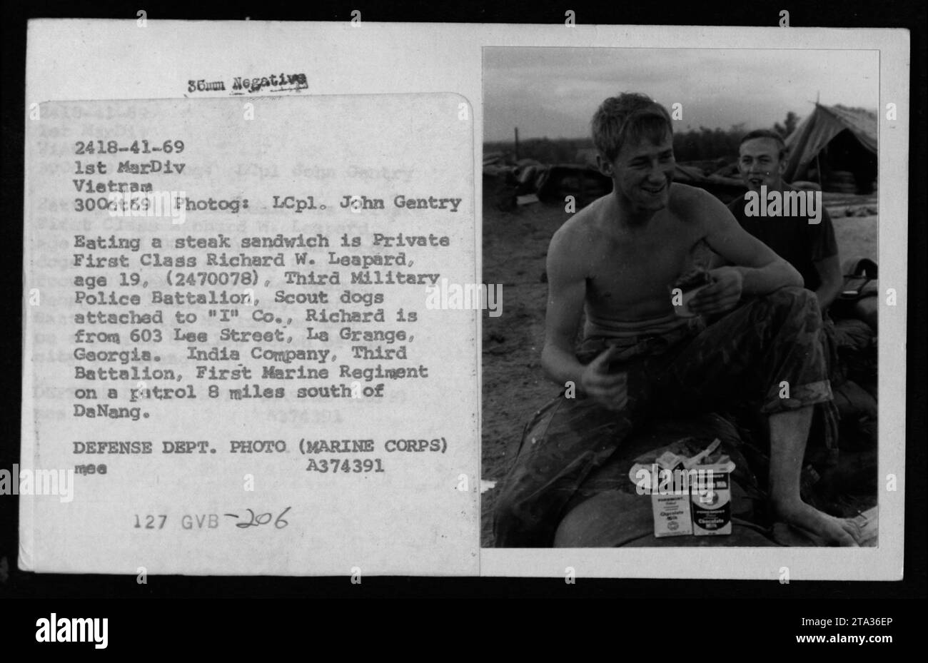 LCpl. John Gentry captures a moment of PFC Richard W. Leppard eating a ...