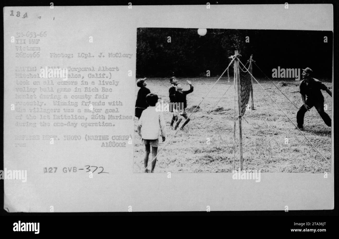 Marine Corps Corporal Albert Hitchell participates in a volleyball game ...