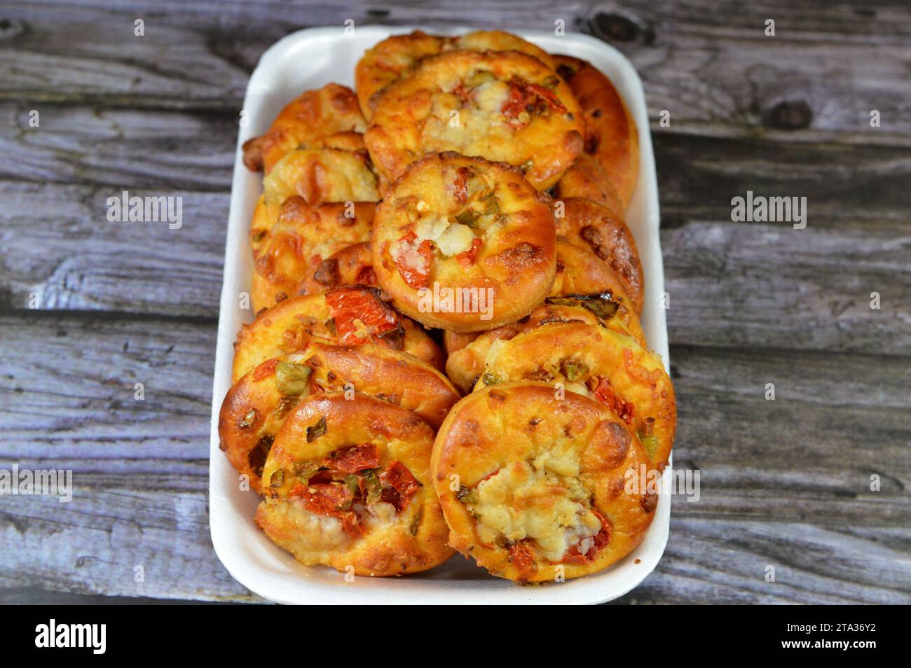 Pile of mini pizzas, Pizza is a dish of Italian origin consisting of a ...