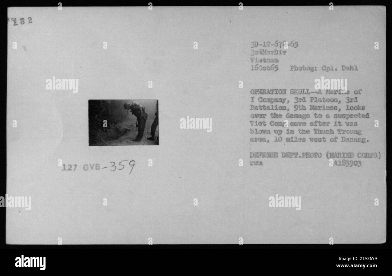 "Marine observes blown-up Viet Cong cave in the Thonh Trong area near ...