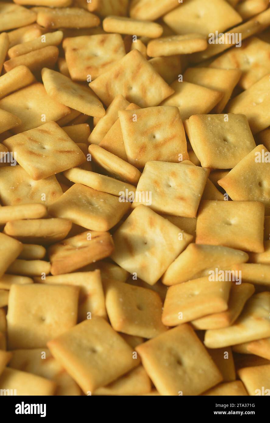 Background texture of small edible squares baked from dough and ...