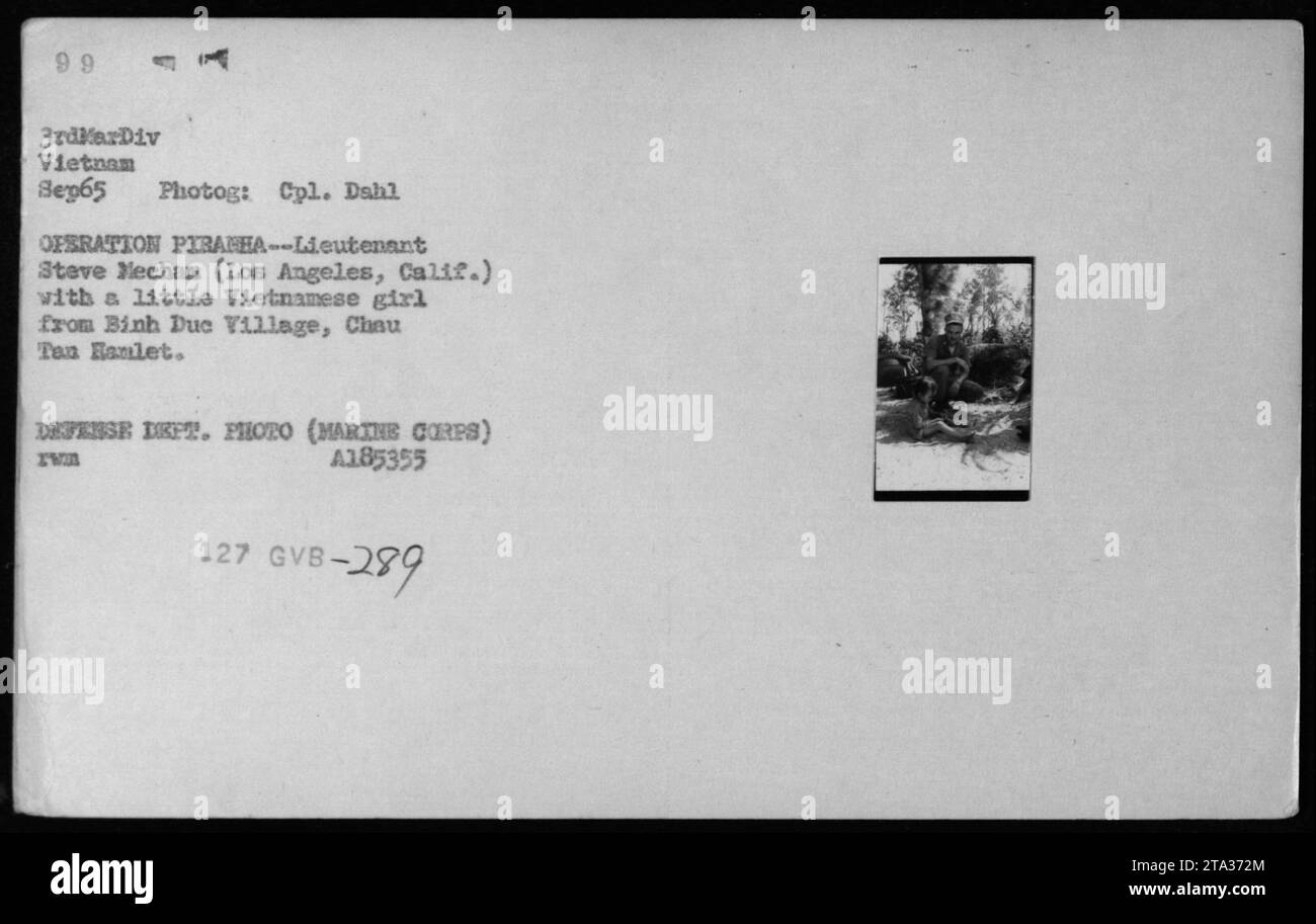 Lieutenant Steve Mecham (Los Angeles, Calif.) interacts with a ...