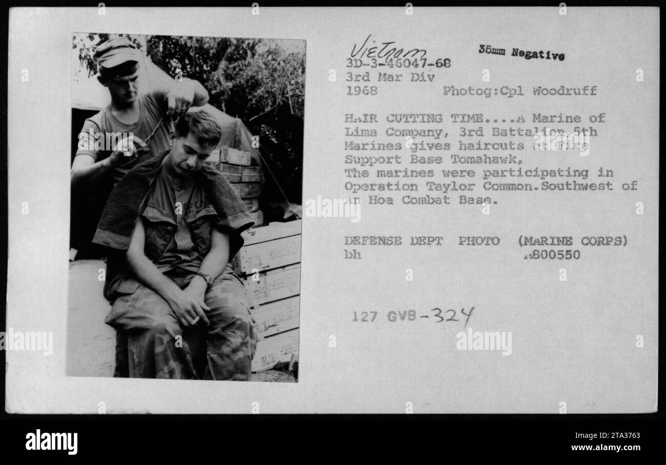 Marine gives haircuts at Fire Support Base Tomahawk during the Vietnam ...
