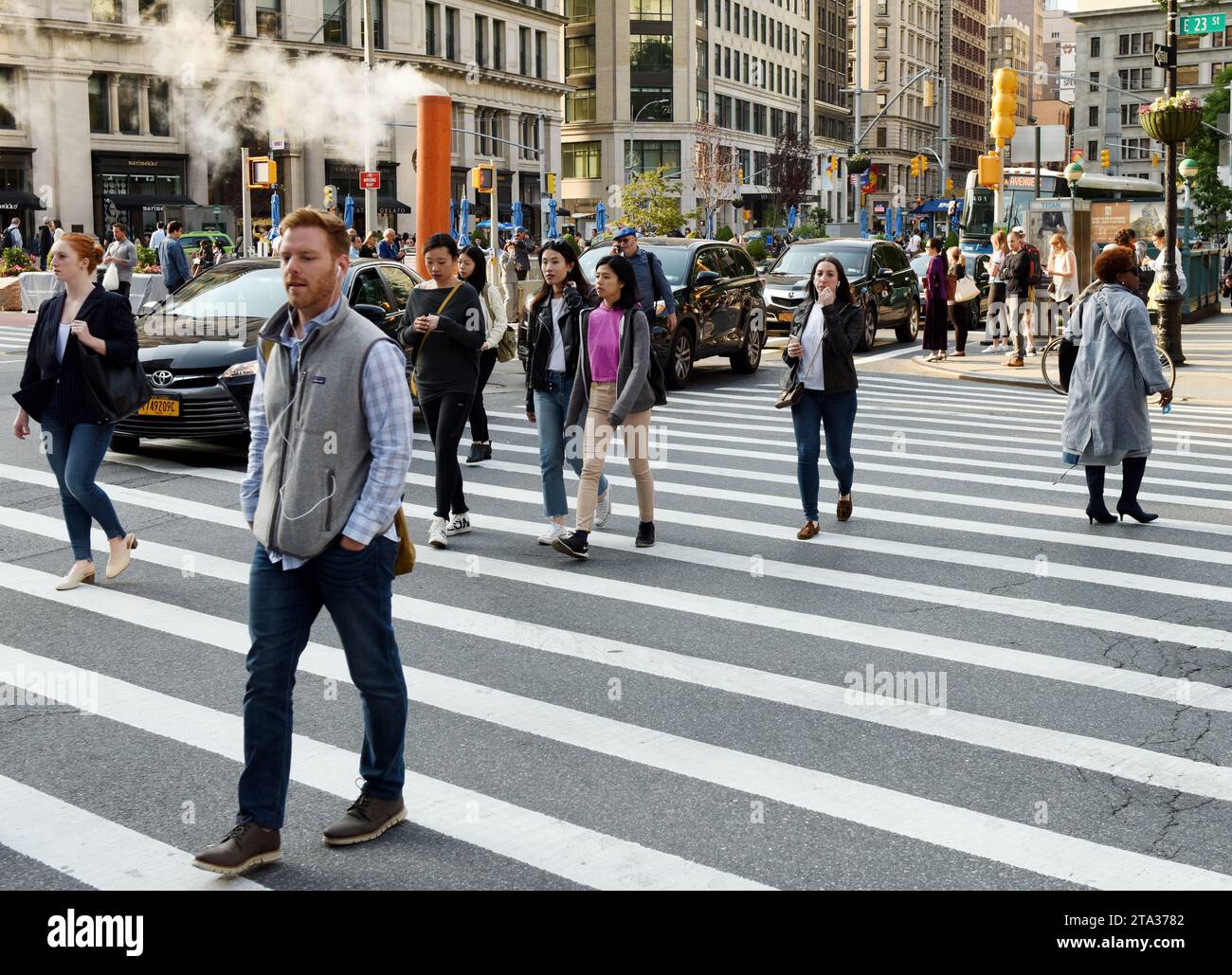 New York, USA - June 7, 2018: People walking on zebra crossings near ...