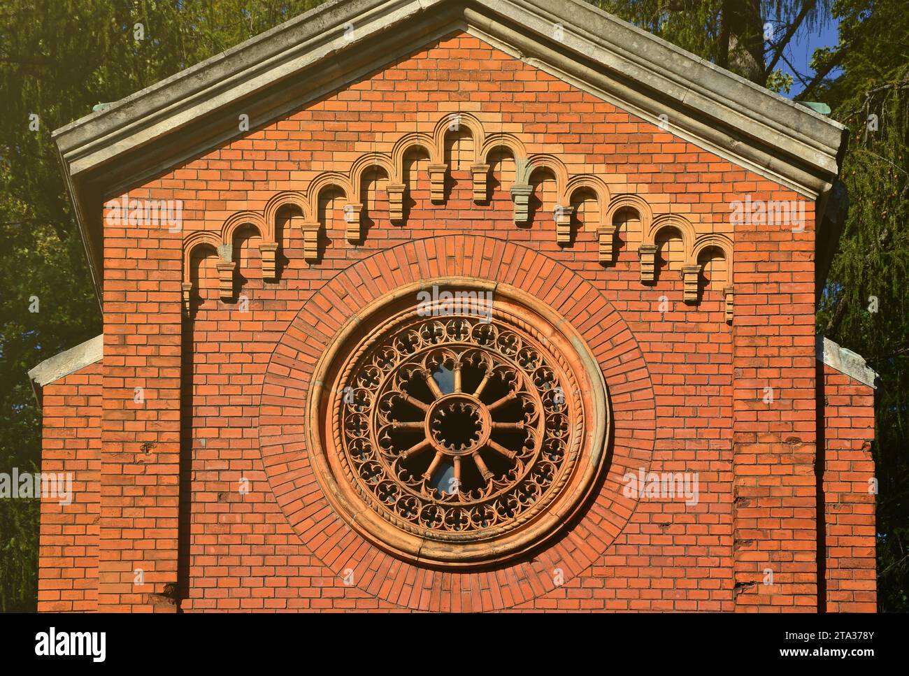 Texture front part of an ancient brick crypt with a round patterned ...